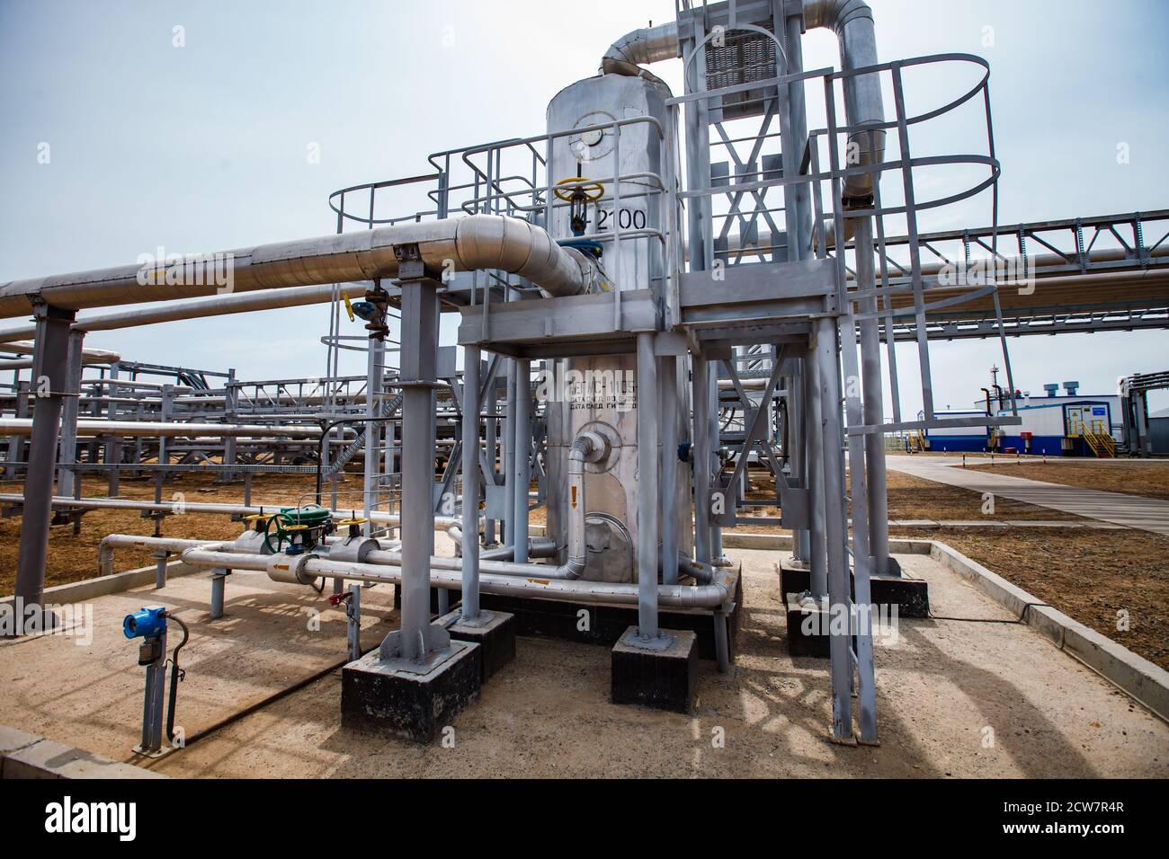 Oil refinery plant in desert sands. Heat exchanger, pipes and pipelines ...
