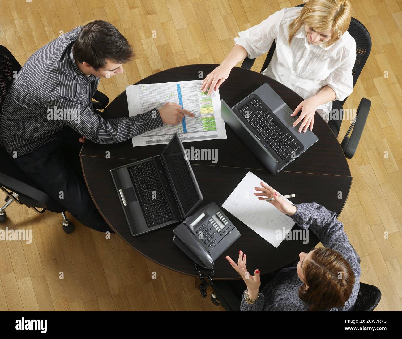 Above view of people working at desk Stock Photo - Alamy