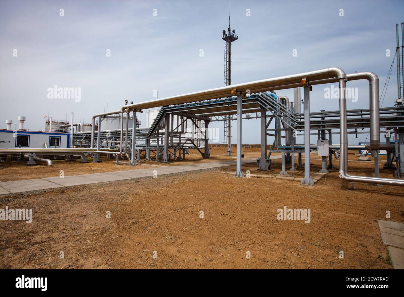 Oil refinery and gas processing plant in desert. Pipelines and a ...