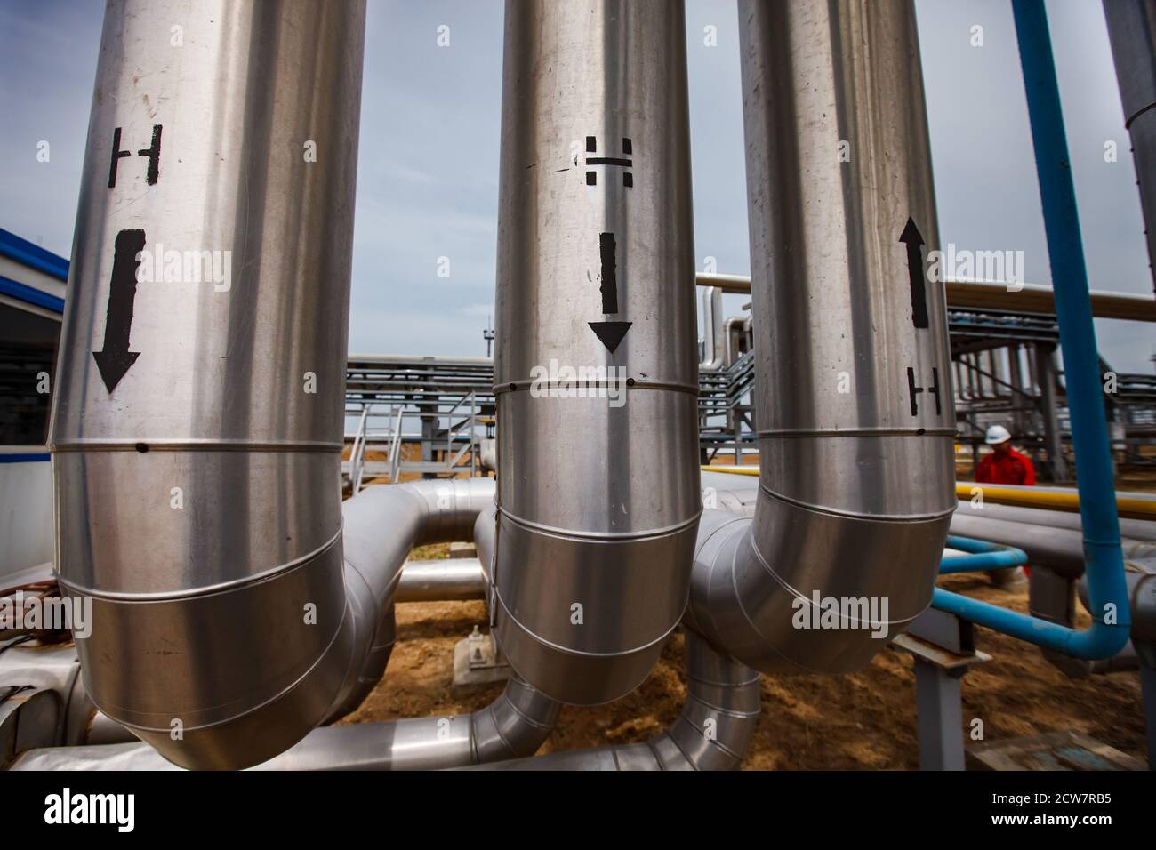 Oil refinery and gas processing plant in desert. Hydrogen sign "H ...