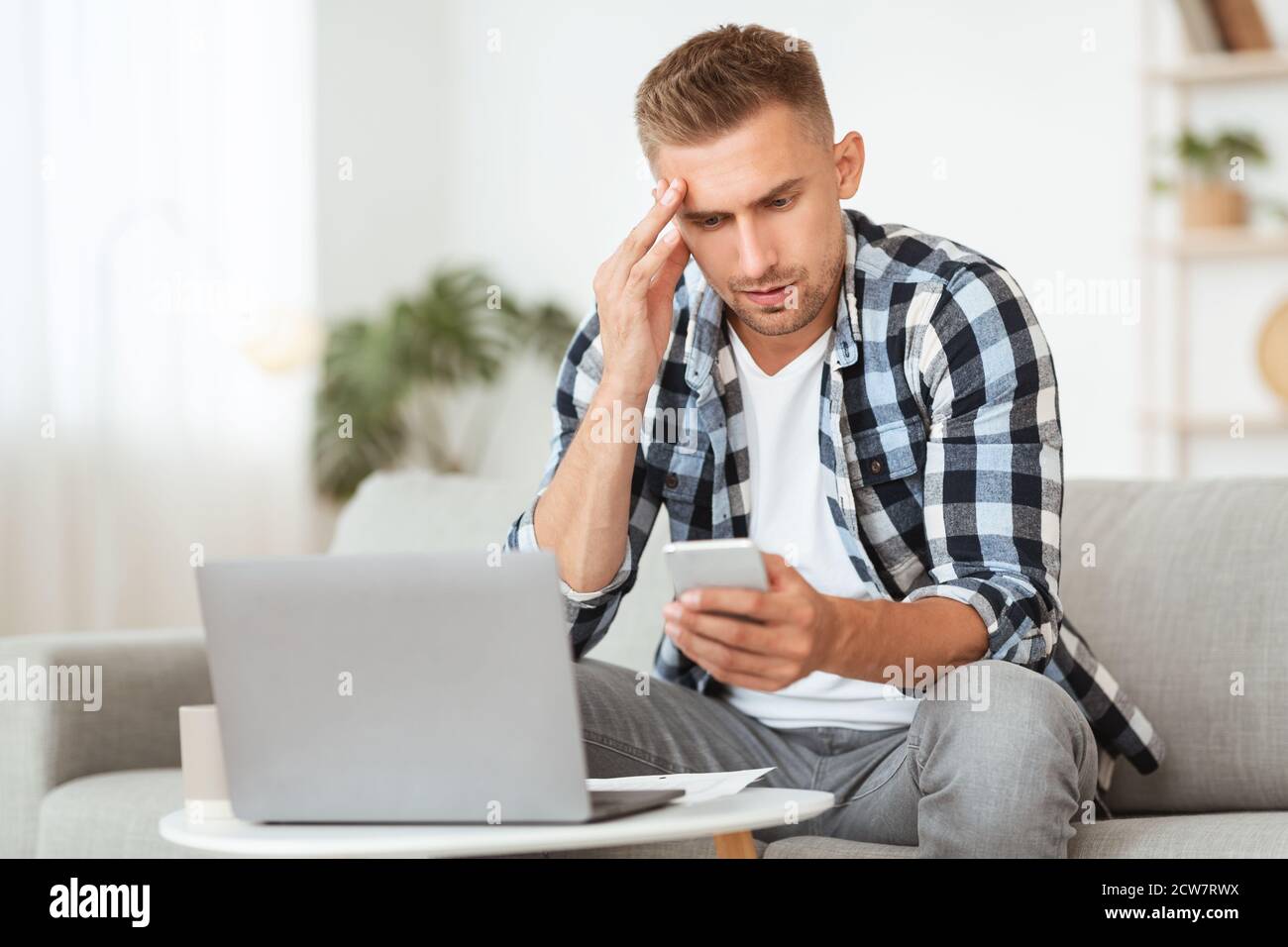 Mobile surprise man home hi-res stock photography and images - Alamy