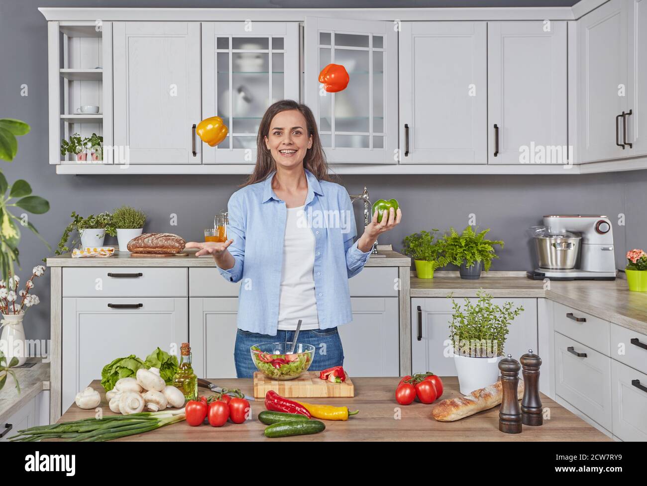 Young beautiful woman in the kitchen Stock Photo - Alamy