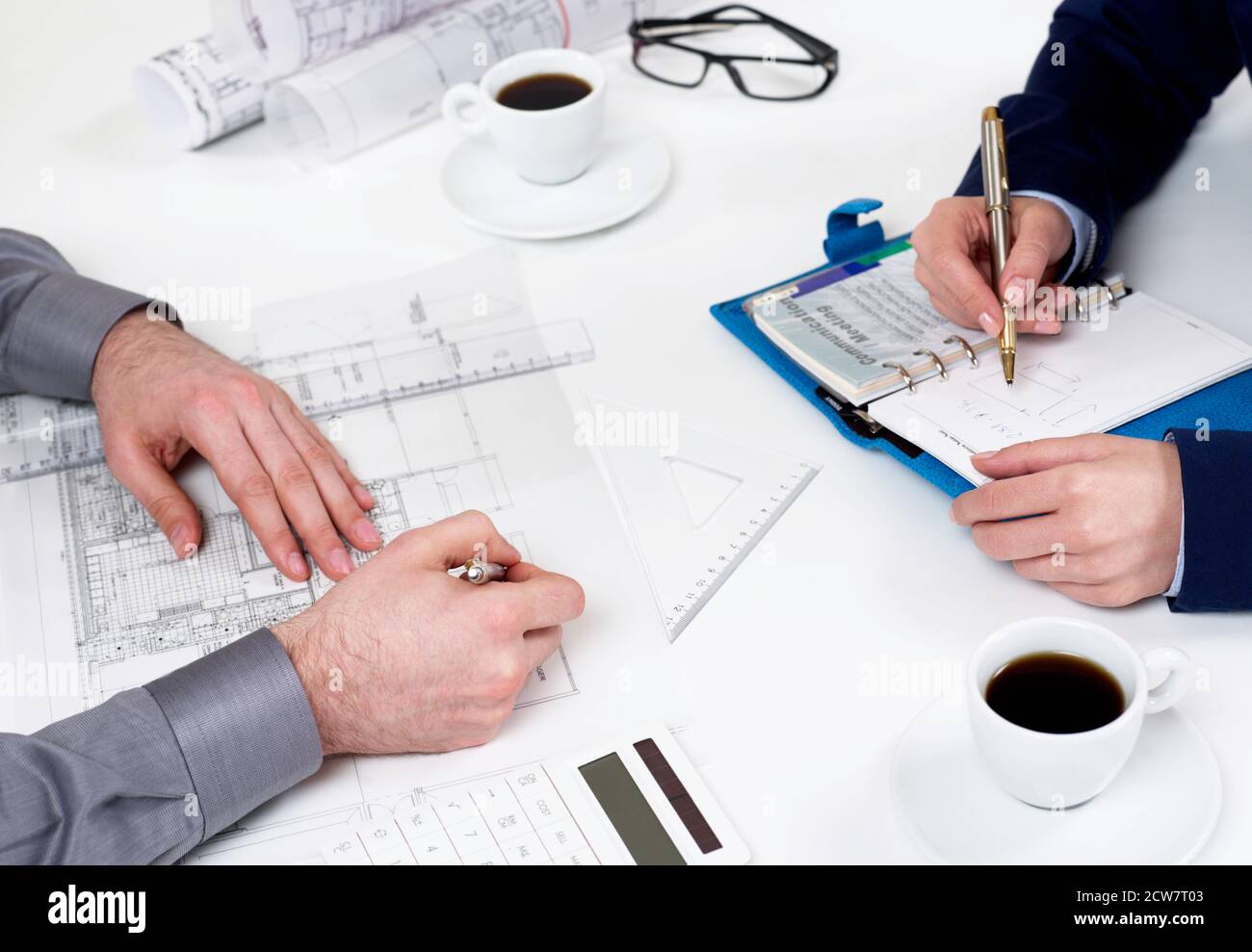 People working on blueprints Stock Photo - Alamy