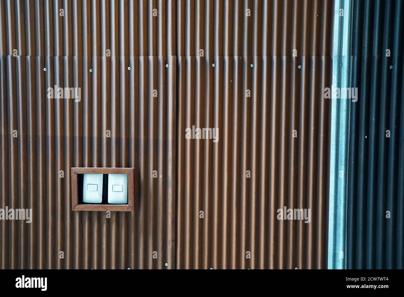 Wooden Lighting switch box decorated in metal zinc sheet wall Stock ...