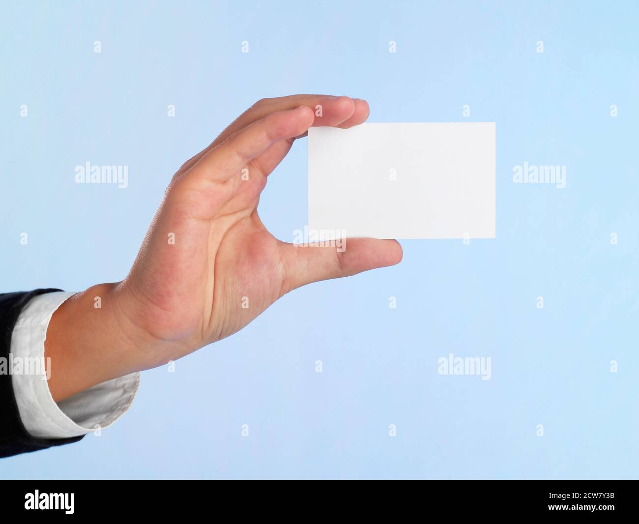 Woman showing her business card Stock Photo - Alamy