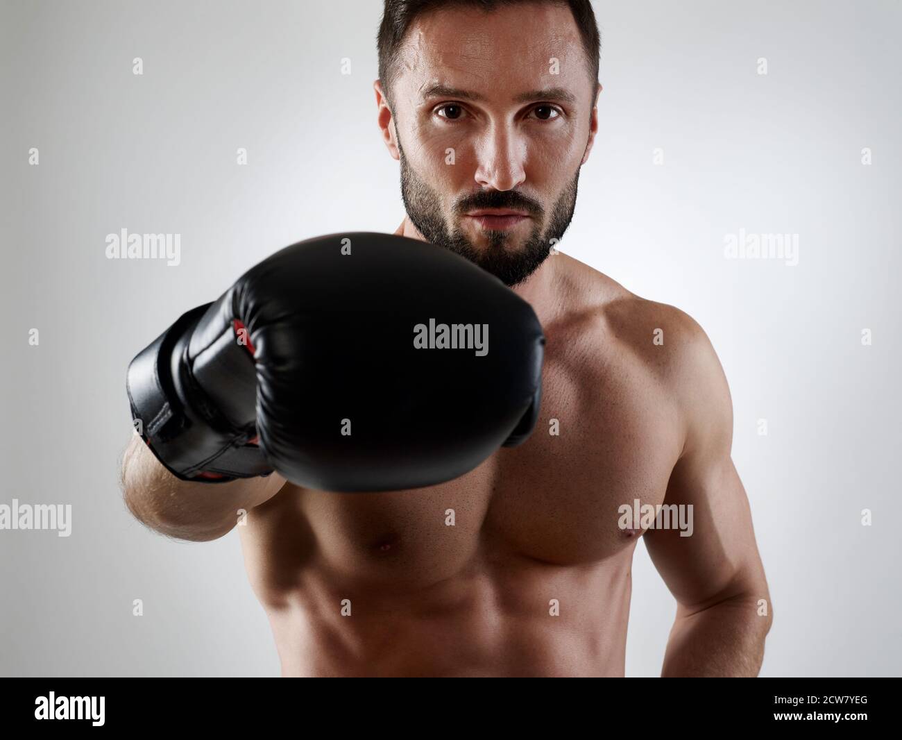 Shirtless muscular boxer with boxing glove Stock Photo - Alamy