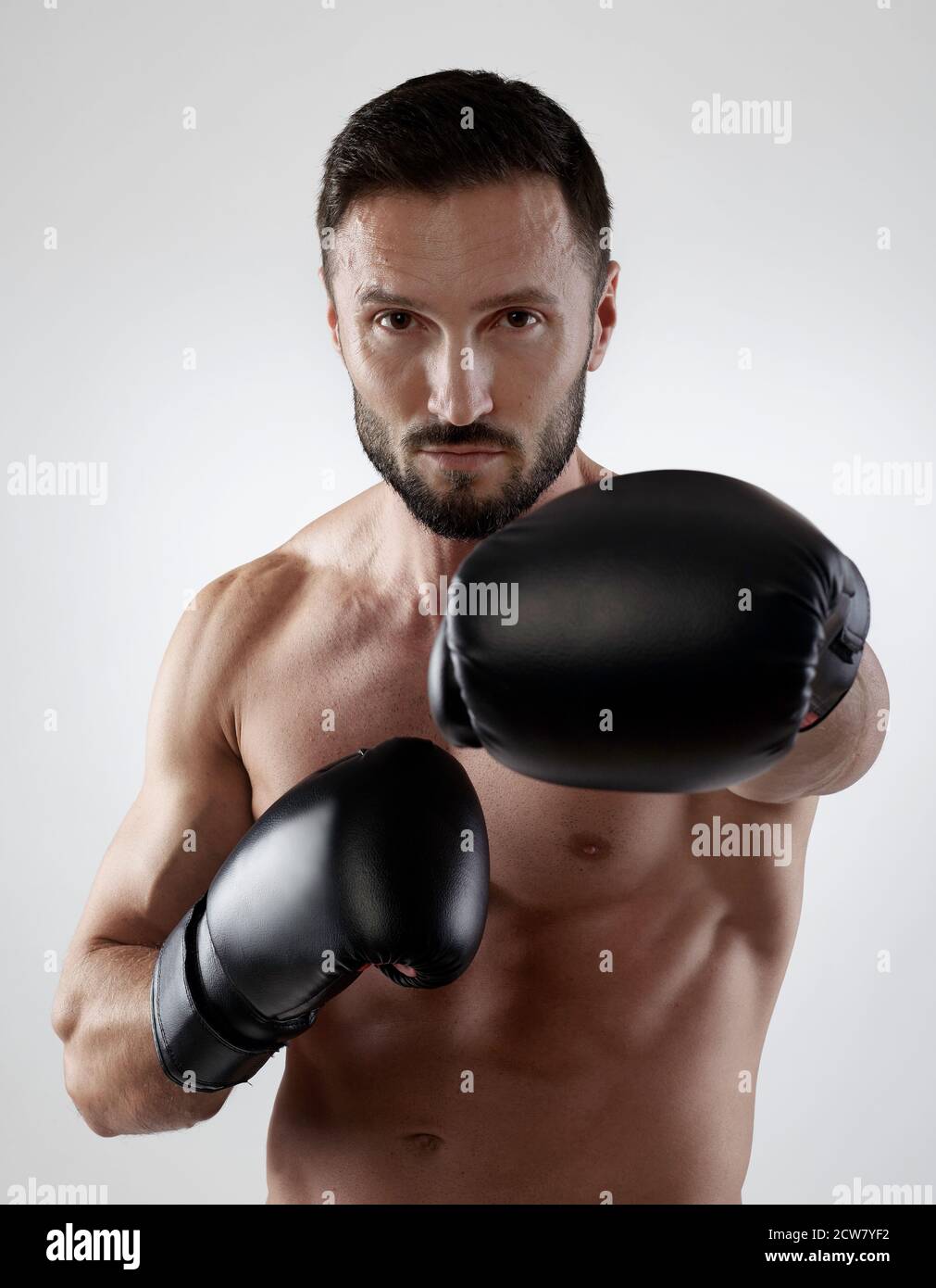 Confident muscular boxer with boxing gloves Stock Photo - Alamy