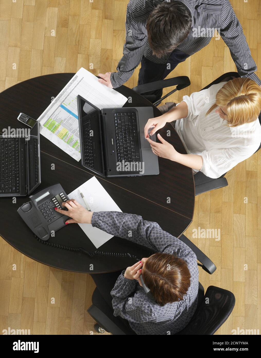 Above view of people working at desk Stock Photo - Alamy