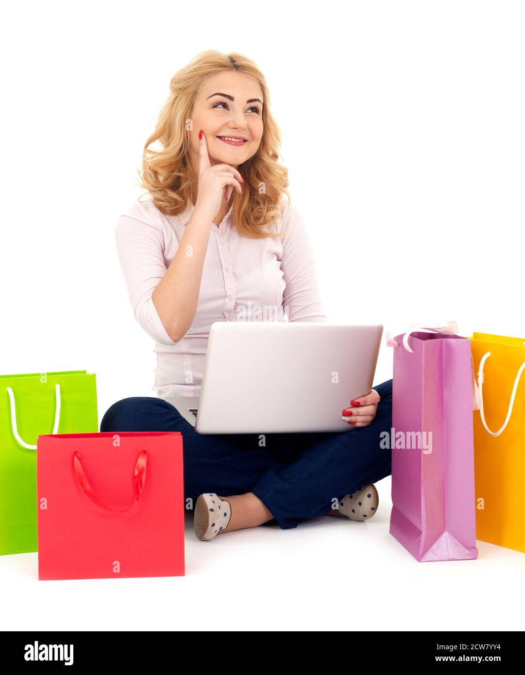 Cheerful girl with credit card and laptop Stock Photo - Alamy