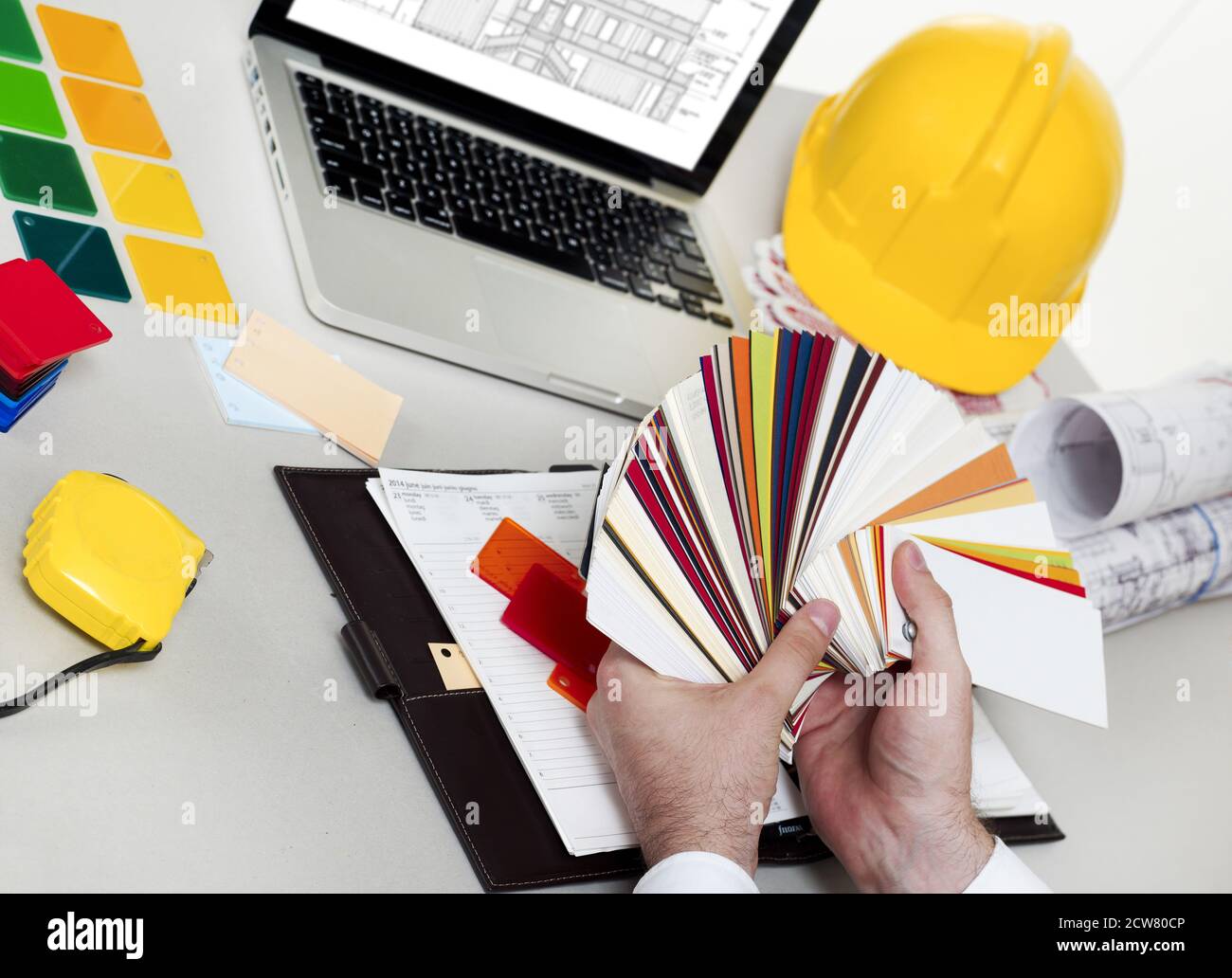 Man with color swatches at desk Stock Photo - Alamy