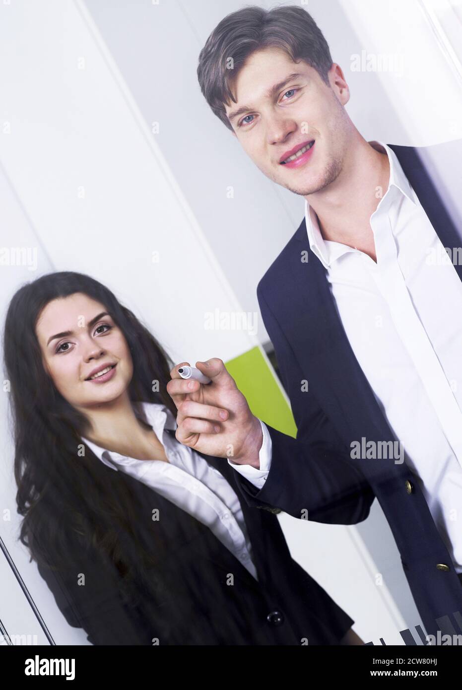 Co-workers planning strategy Stock Photo - Alamy