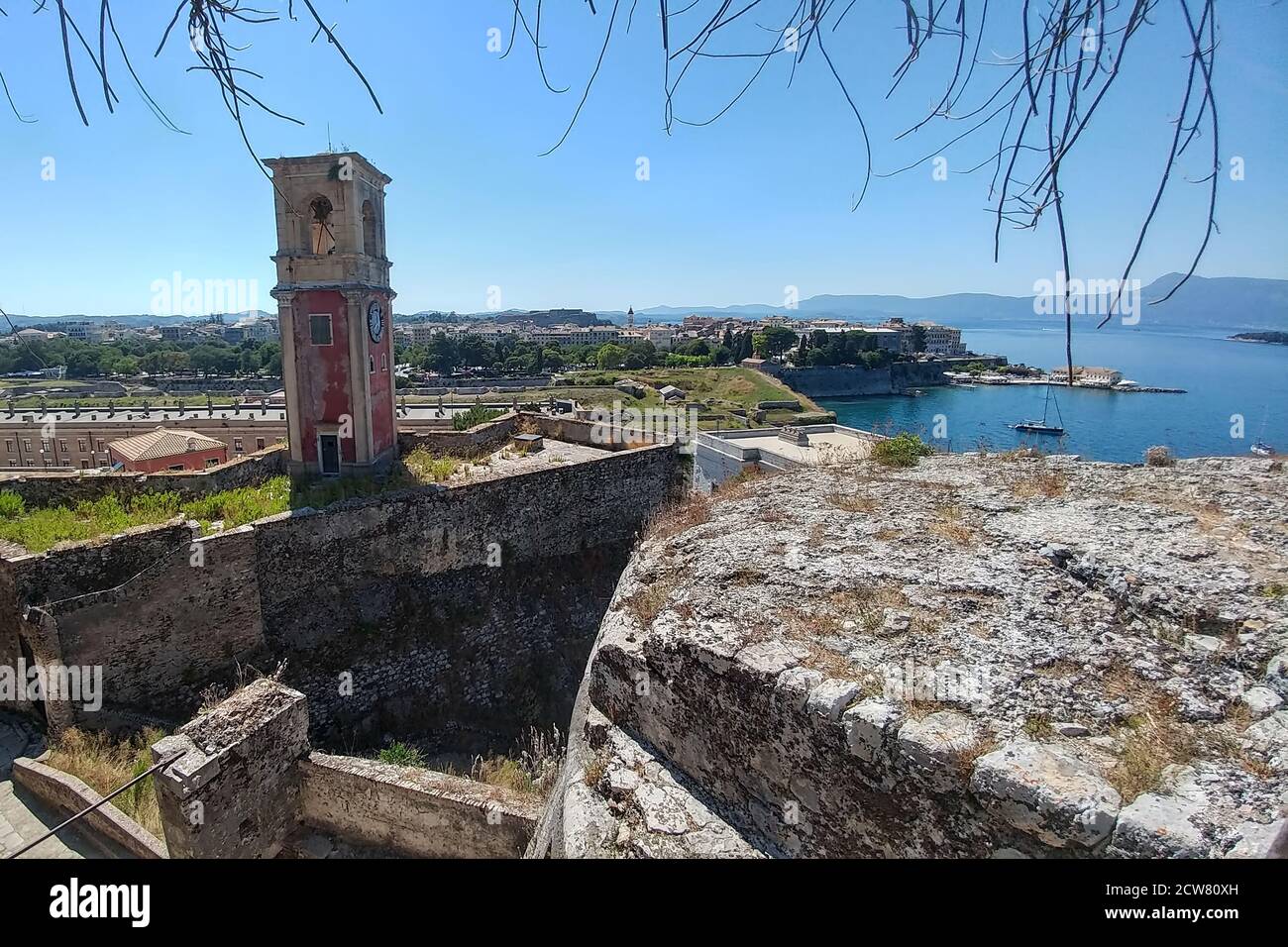 An old fort with an observation tower on which hangs a huge ancient ...