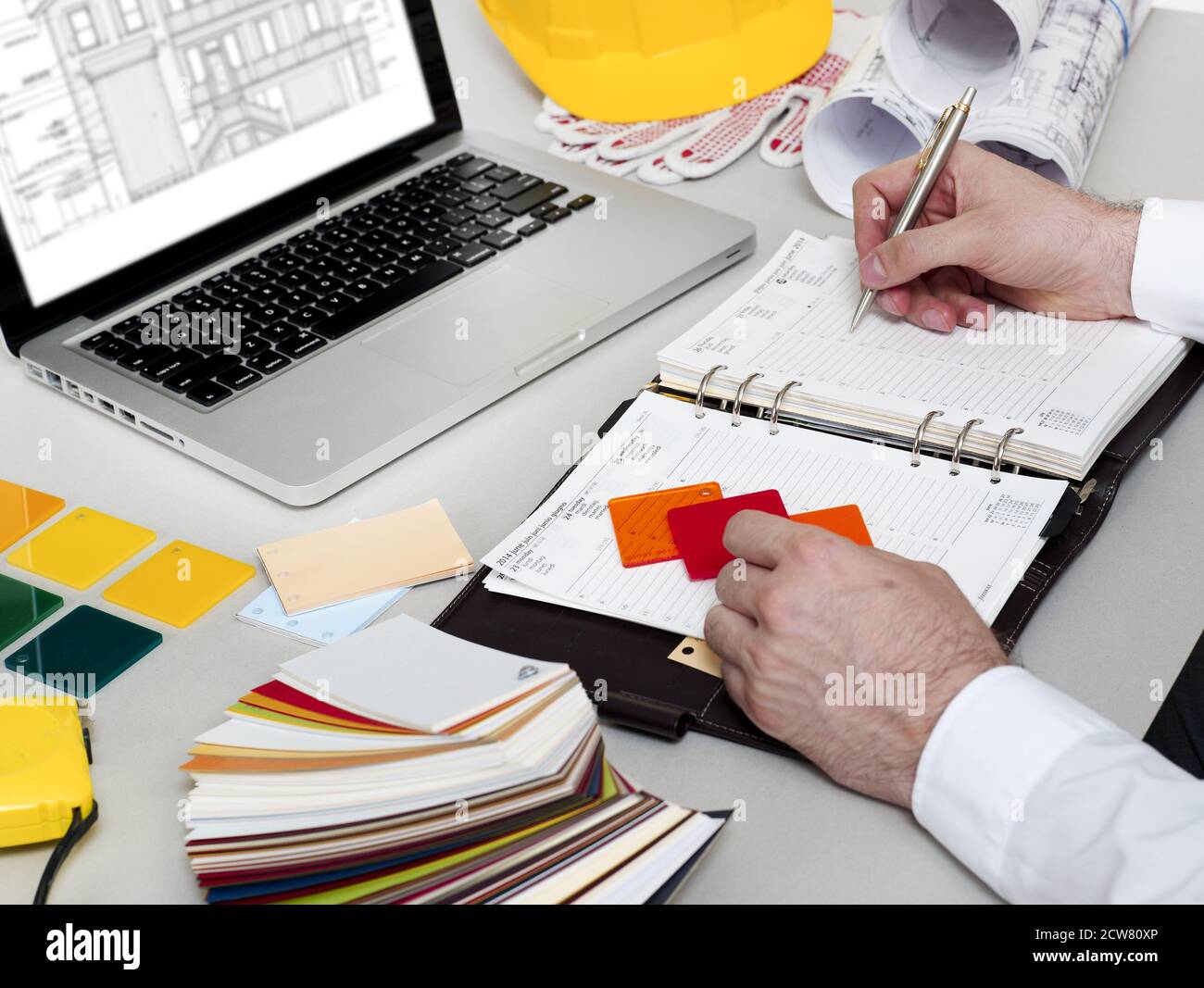 Construction engineer choosing the color Stock Photo - Alamy
