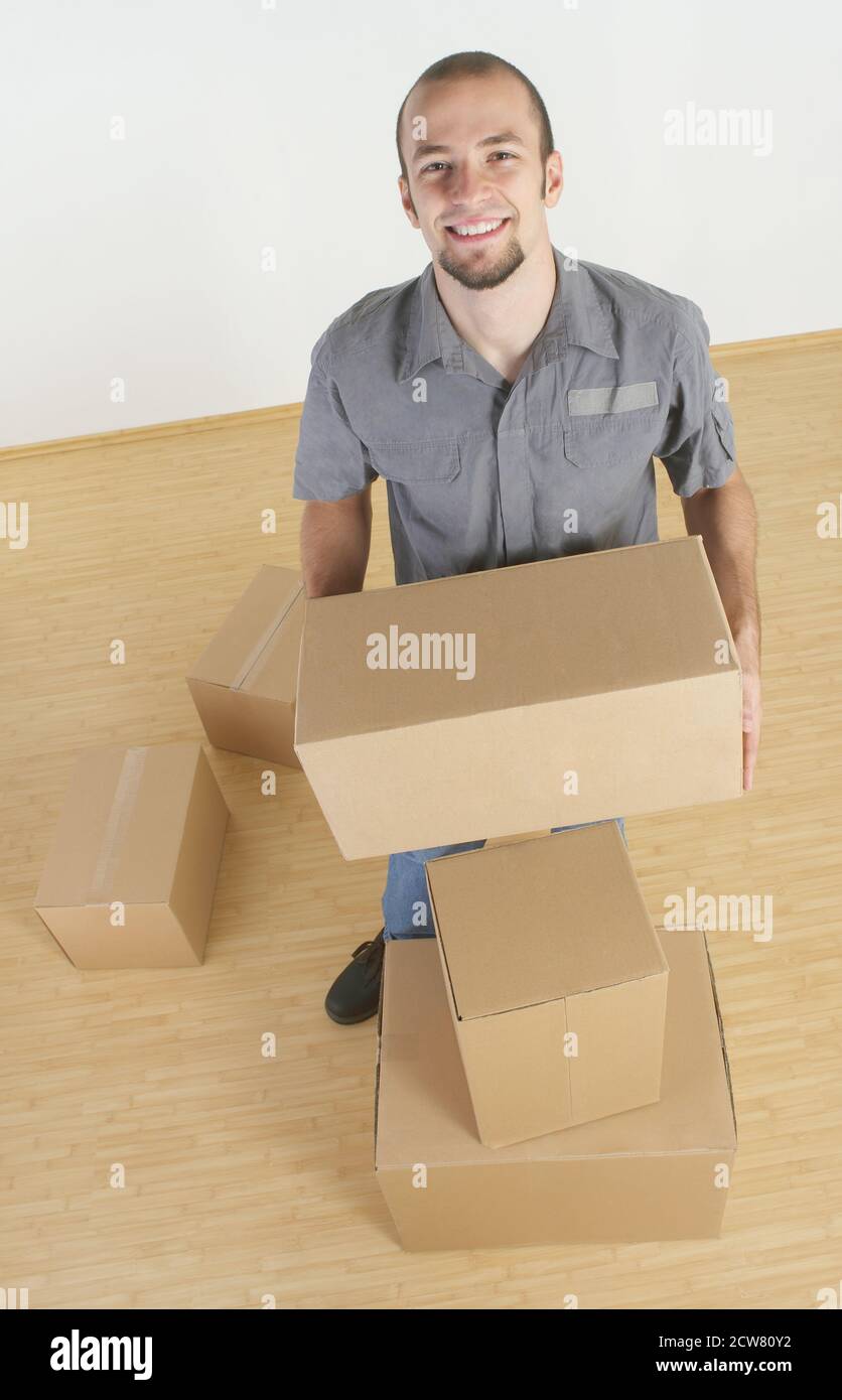 Mover guy holding cardboard hi-res stock photography and images - Alamy