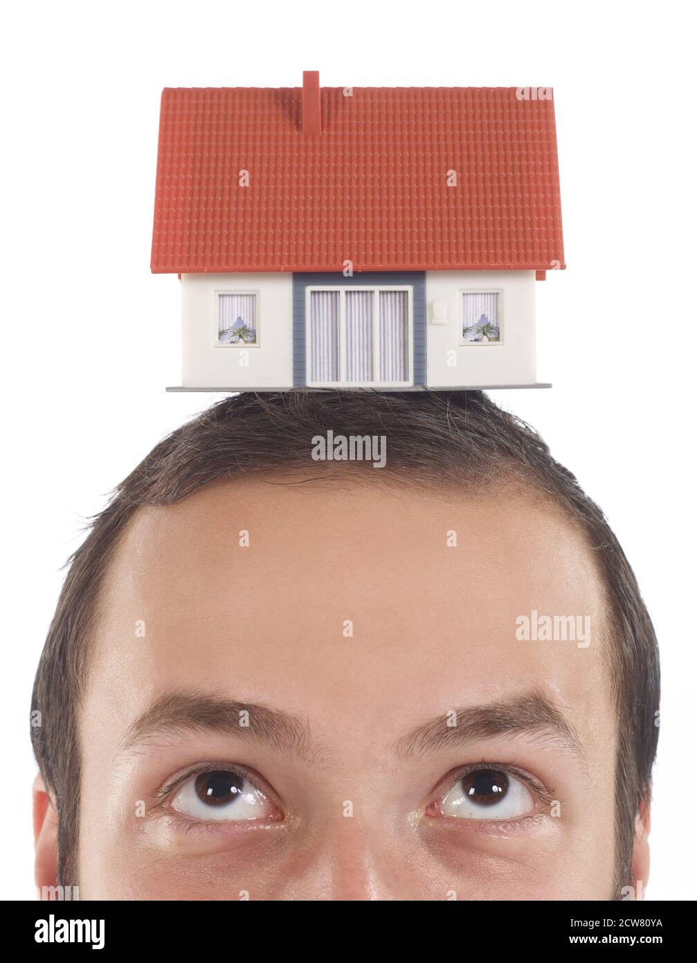 Man with a house on his head Stock Photo - Alamy