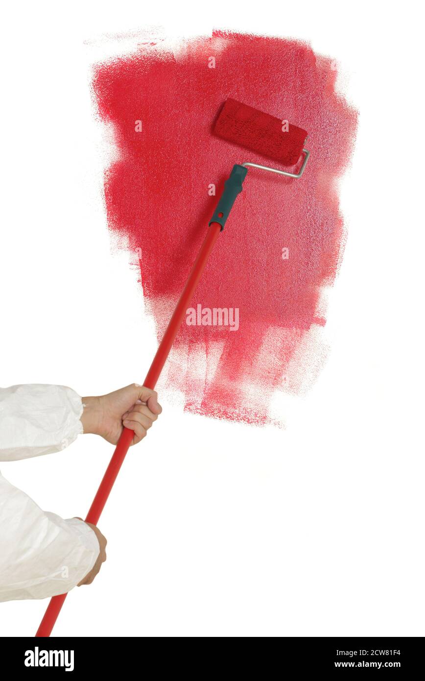 Hand with paint roller Stock Photo - Alamy