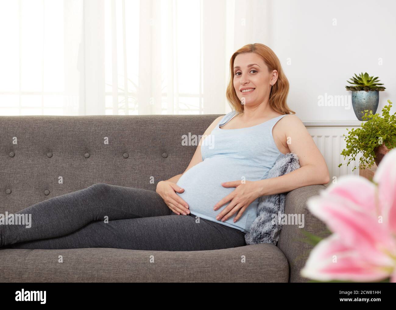 Pregnant woman expecting a baby Stock Photo - Alamy