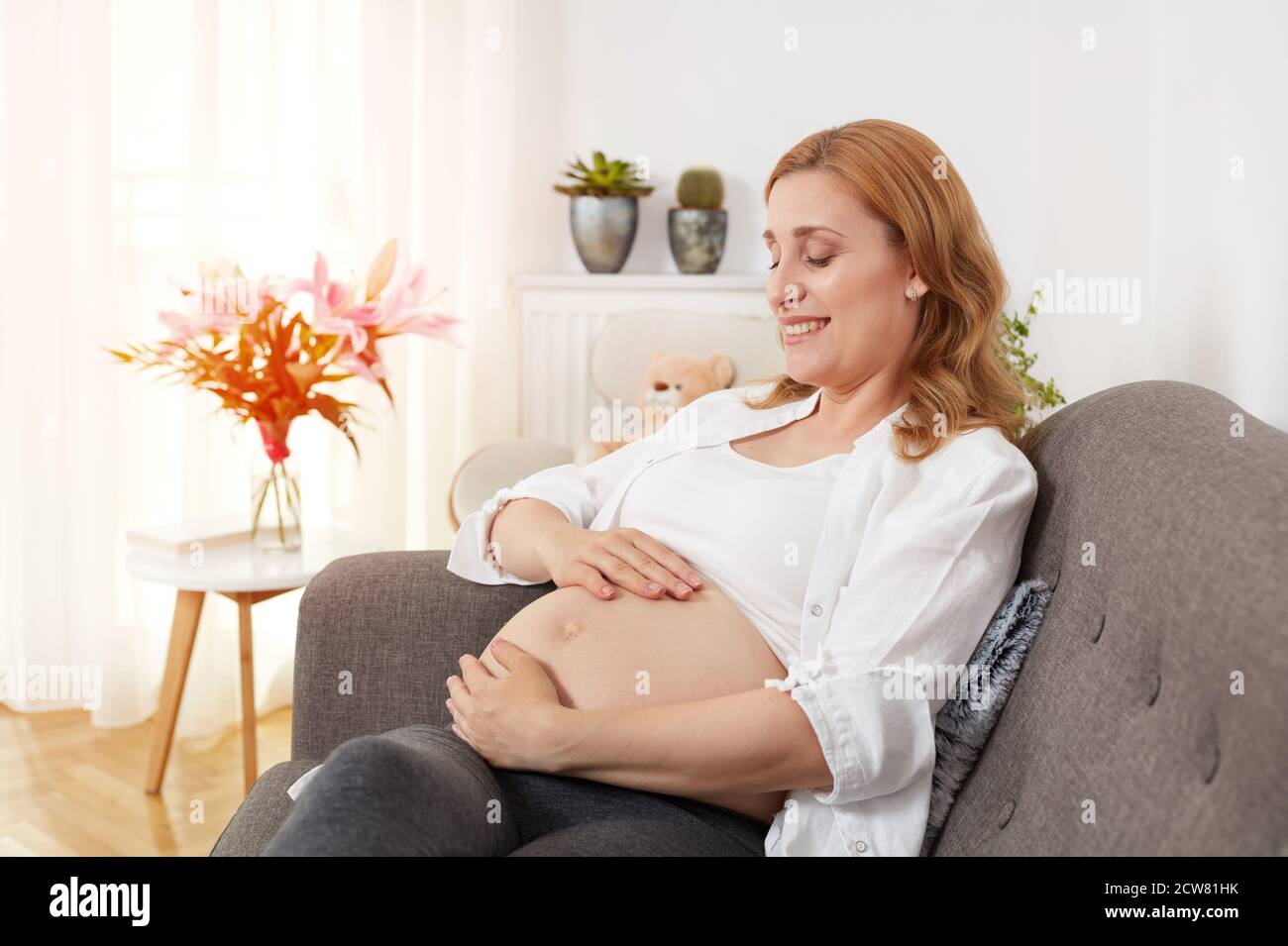 Pregnant woman expecting a baby Stock Photo - Alamy
