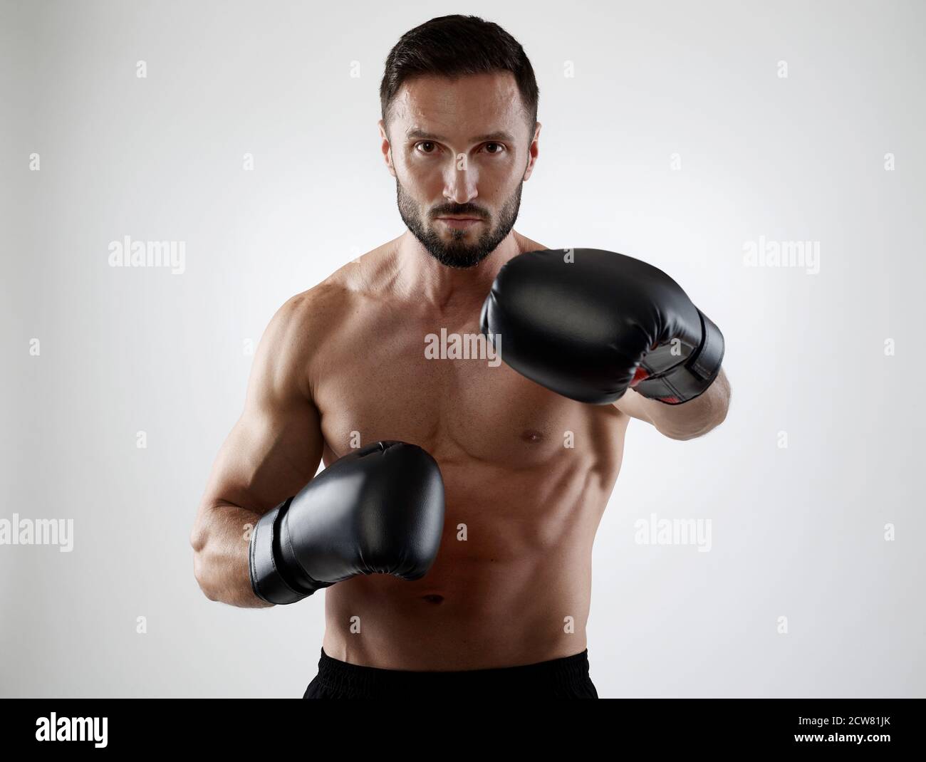 Boxer wearing boxing gloves Stock Photo - Alamy