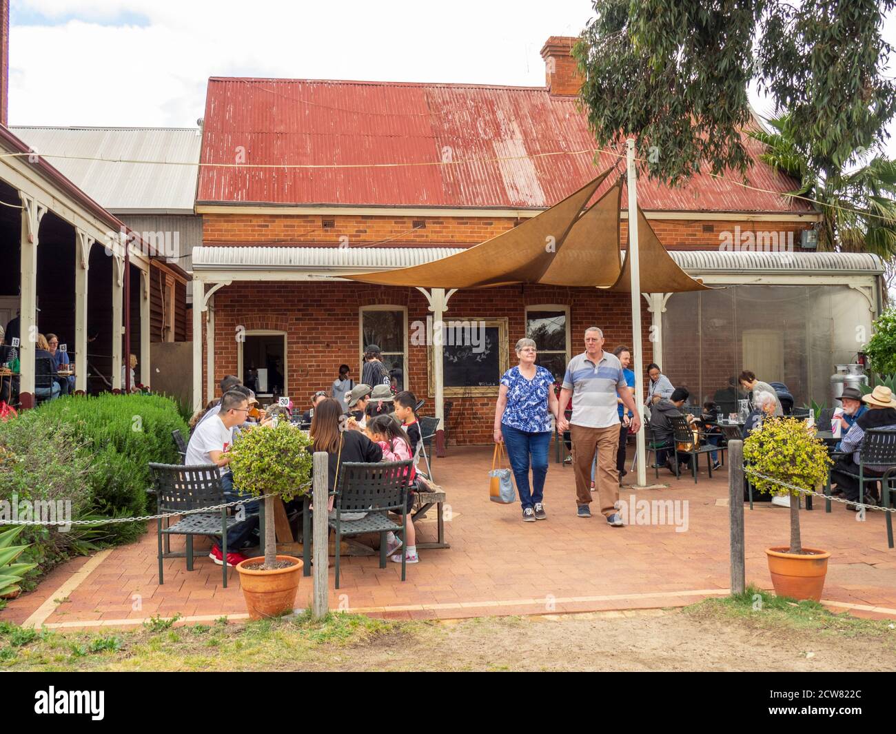 Elderly couple holding hands leaving the York Flour Mill cafe York ...
