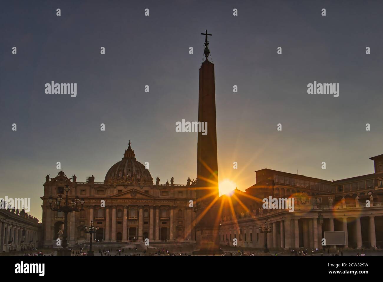 Sunburst behind St Peter's Basilica and the Obelisk, St Peter's Square ...