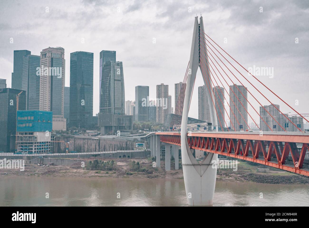 The Qiansimen bridge and the skyline in Chongqing, China, on a cloudy ...