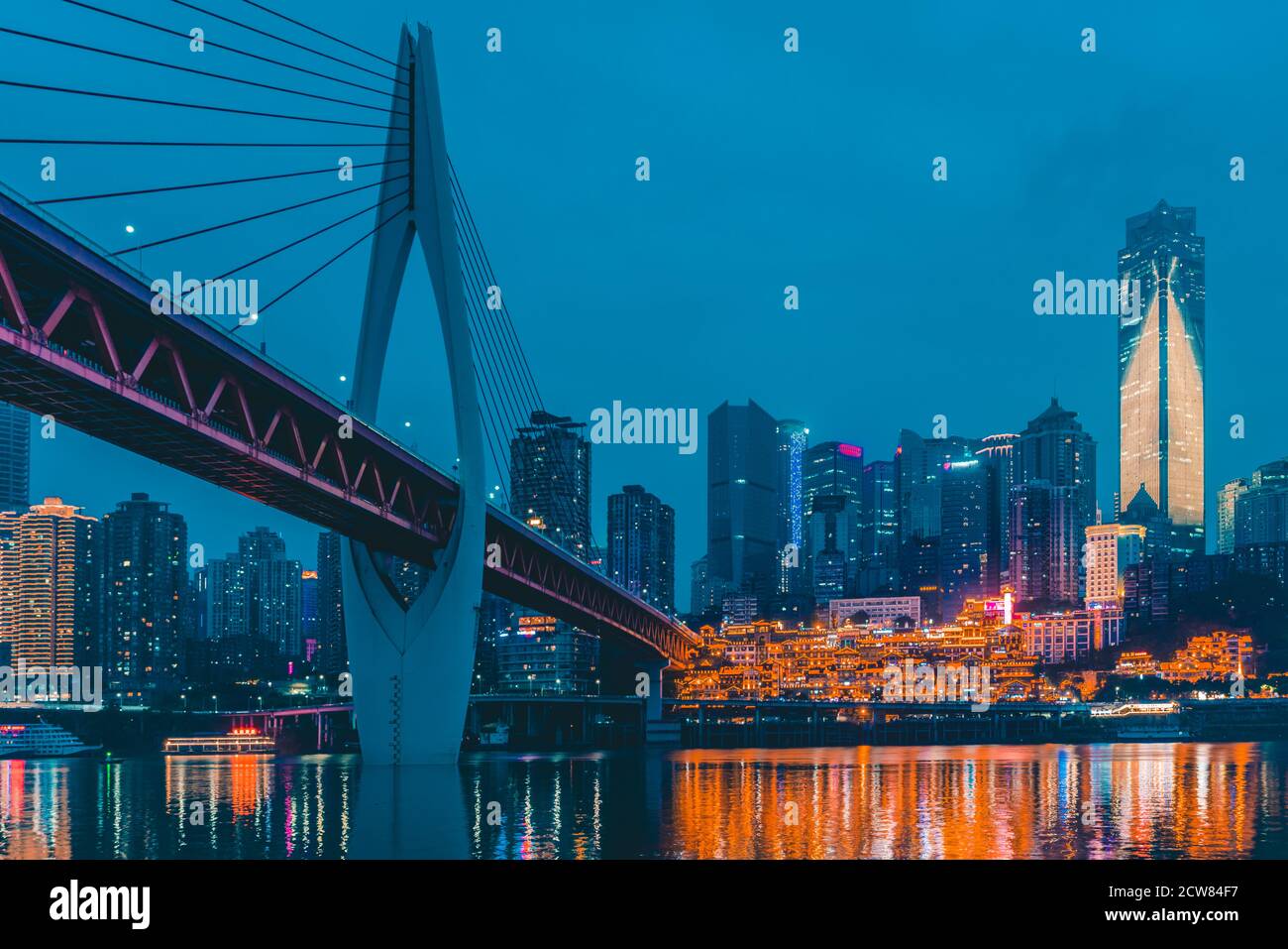 The night view of Qiansimen bridge and the skyline in Chongqing, China ...