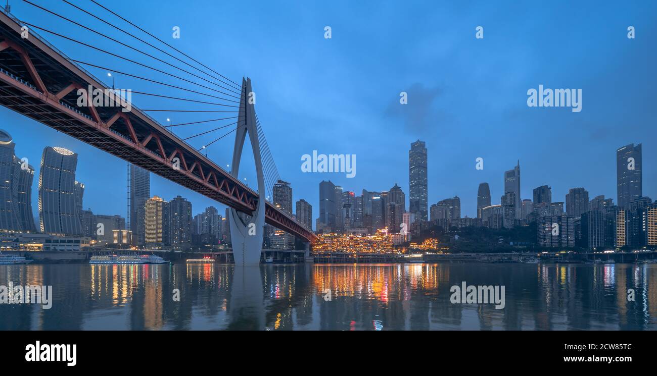 The night view of Qiansimen bridge and the skyline in Chongqing, China ...