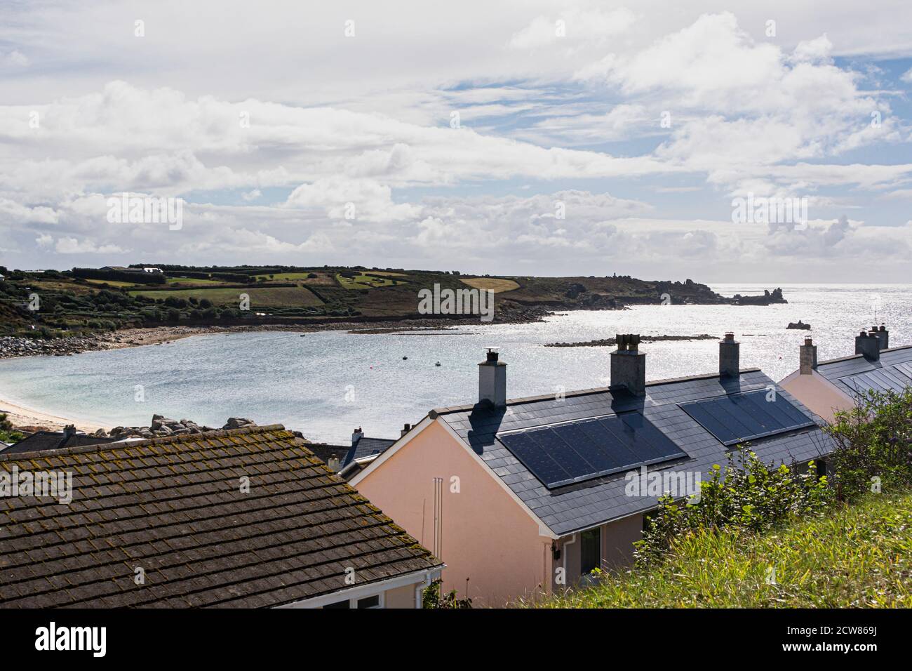 A view of Porthcressa bay and Peninnis Head seen over rooftops from the ...