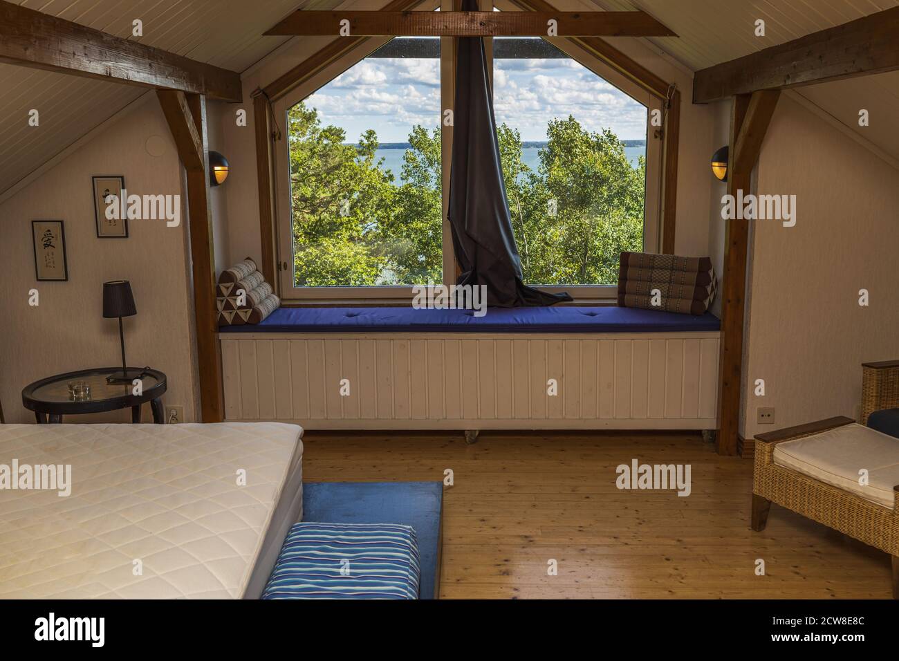 Beautiful interior view of upper floor room with big window with view ...