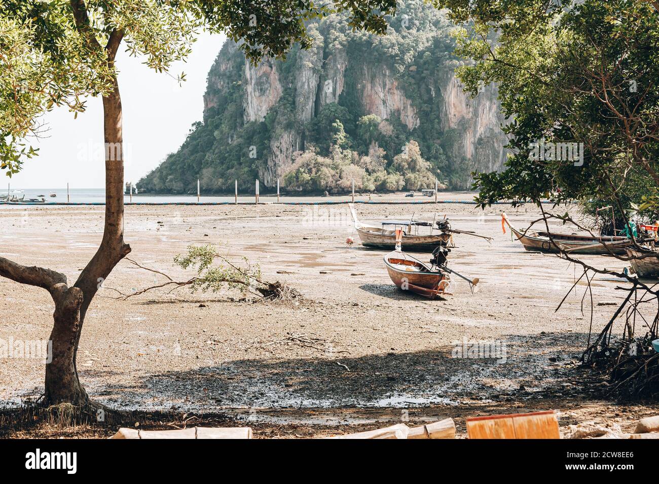 Strong low tide and drought on a tropical island. The boats are aground ...