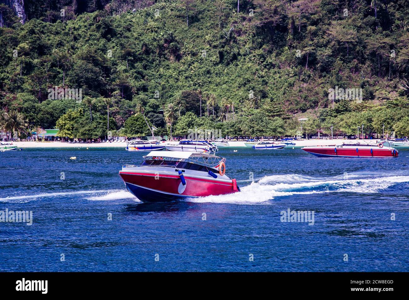 Speedboat accelerates. Floats away from the coast, leaving behind him ...