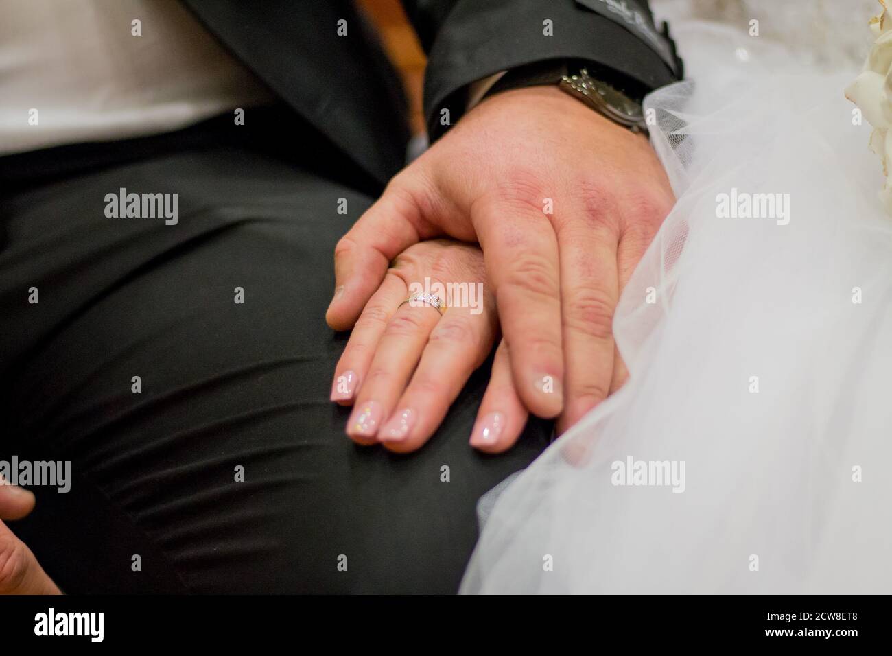 Bride and the groom holding hands at their wedding ceremony Stock Photo ...
