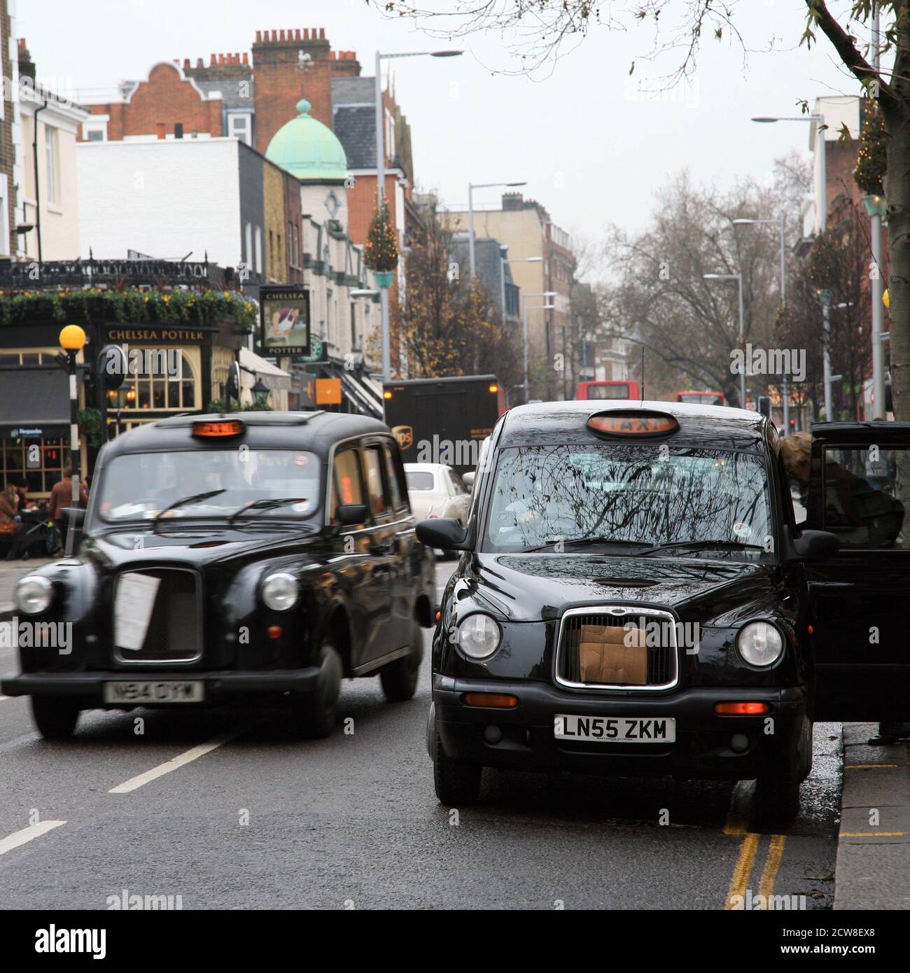 London, UK - October 29, 2010: Taxi in the street of London. Cabs are ...