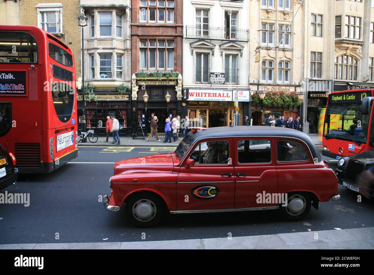London, UK - November 04, 2010: Taxi in the street of London. Cabs are ...