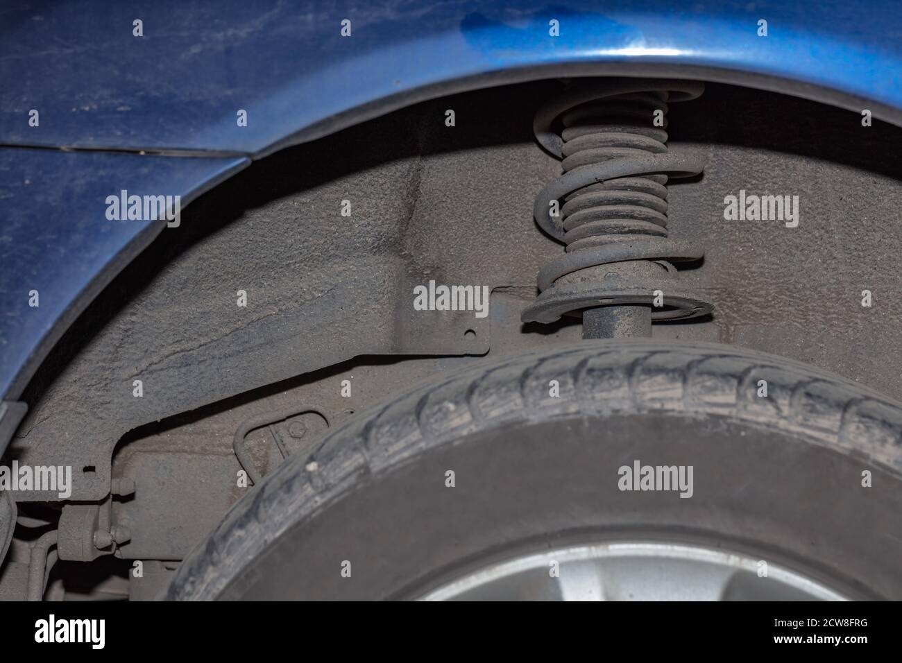 Car rack on a car close-up in a repair workshop. Wheel tuning disk ...