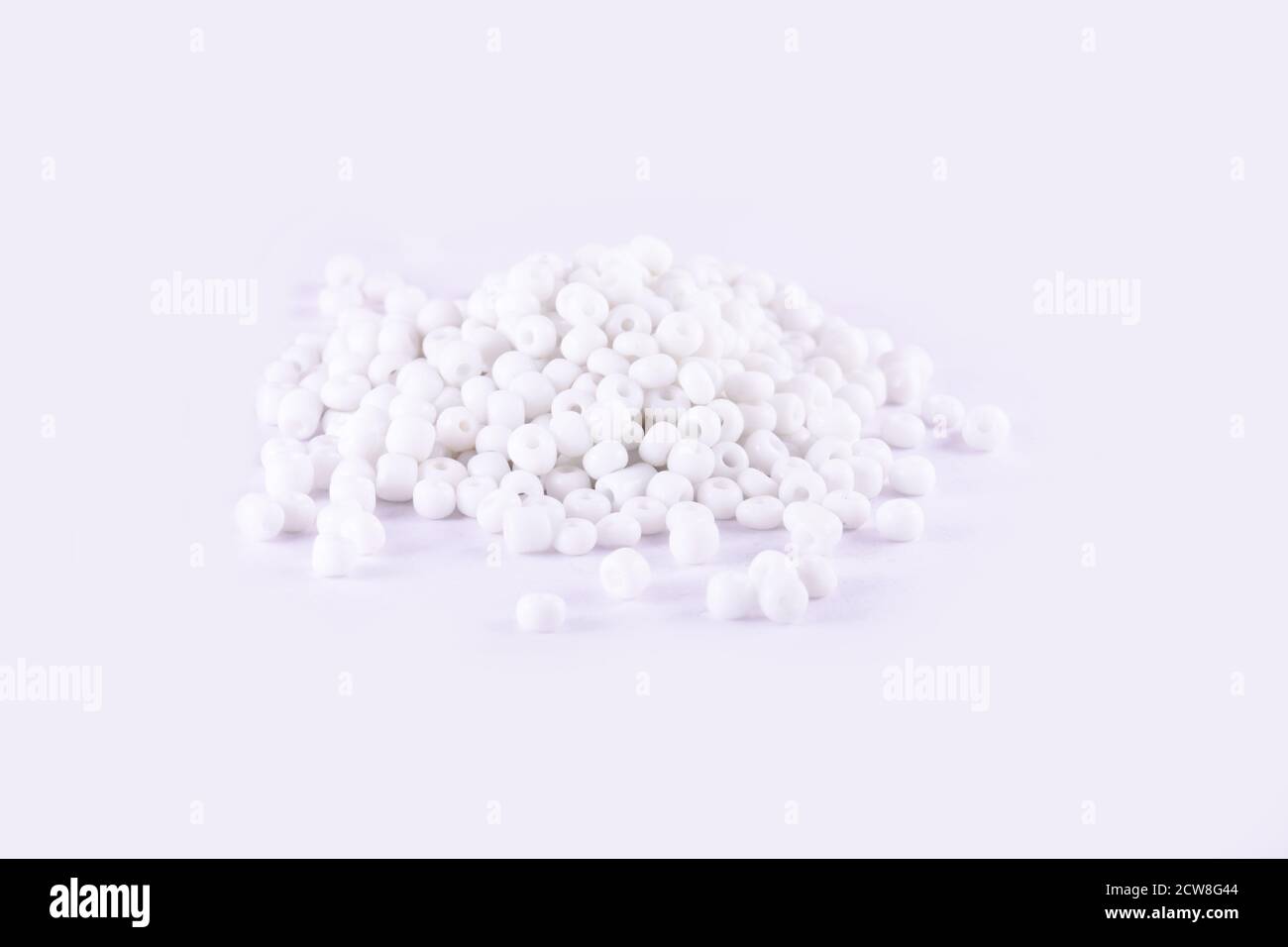 Beads spread on white background. Background or texture of beads. Close ...