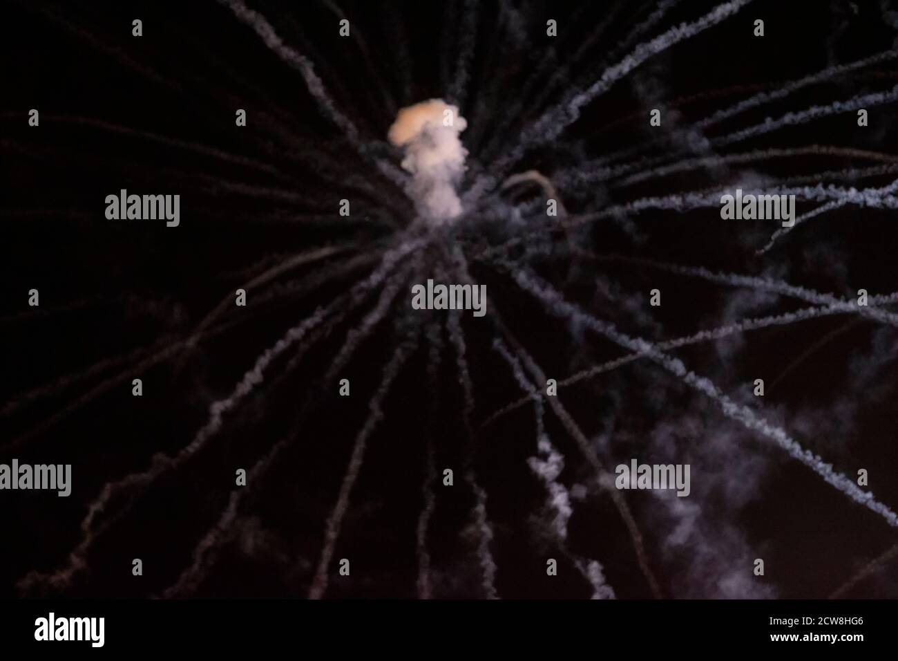 Smoke rays on a black background. Festive background Stock Photo - Alamy