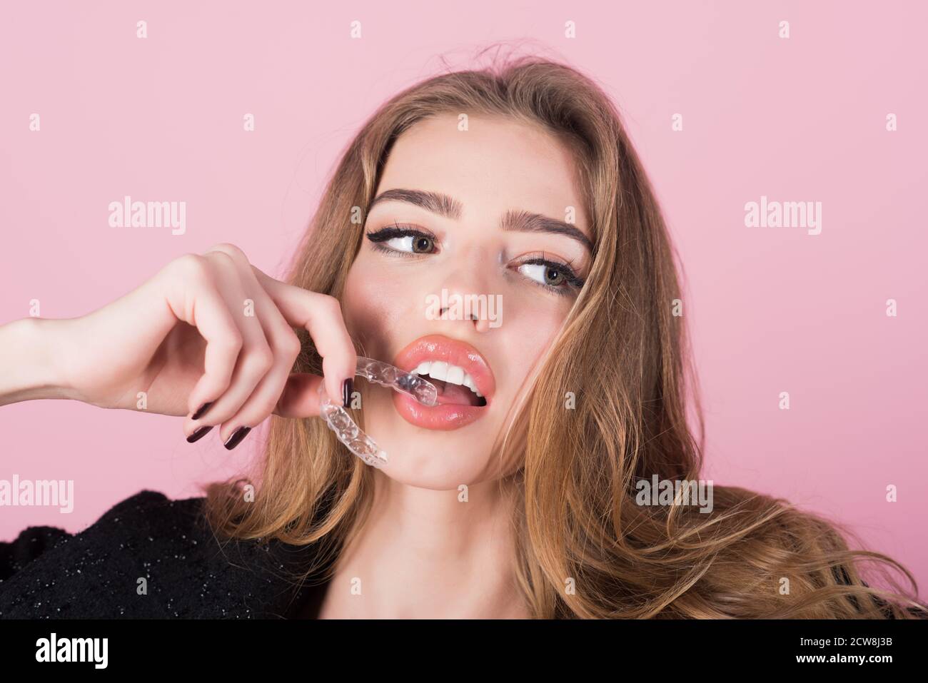 Teeth retainer for improving bite. Teeth care. Woman holds teeth ...