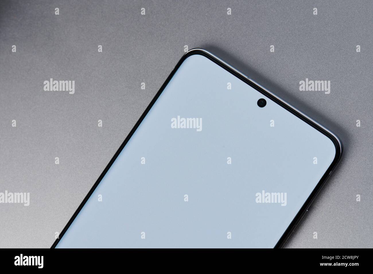 Empty smartphone top part of screen close up on grey background Stock ...