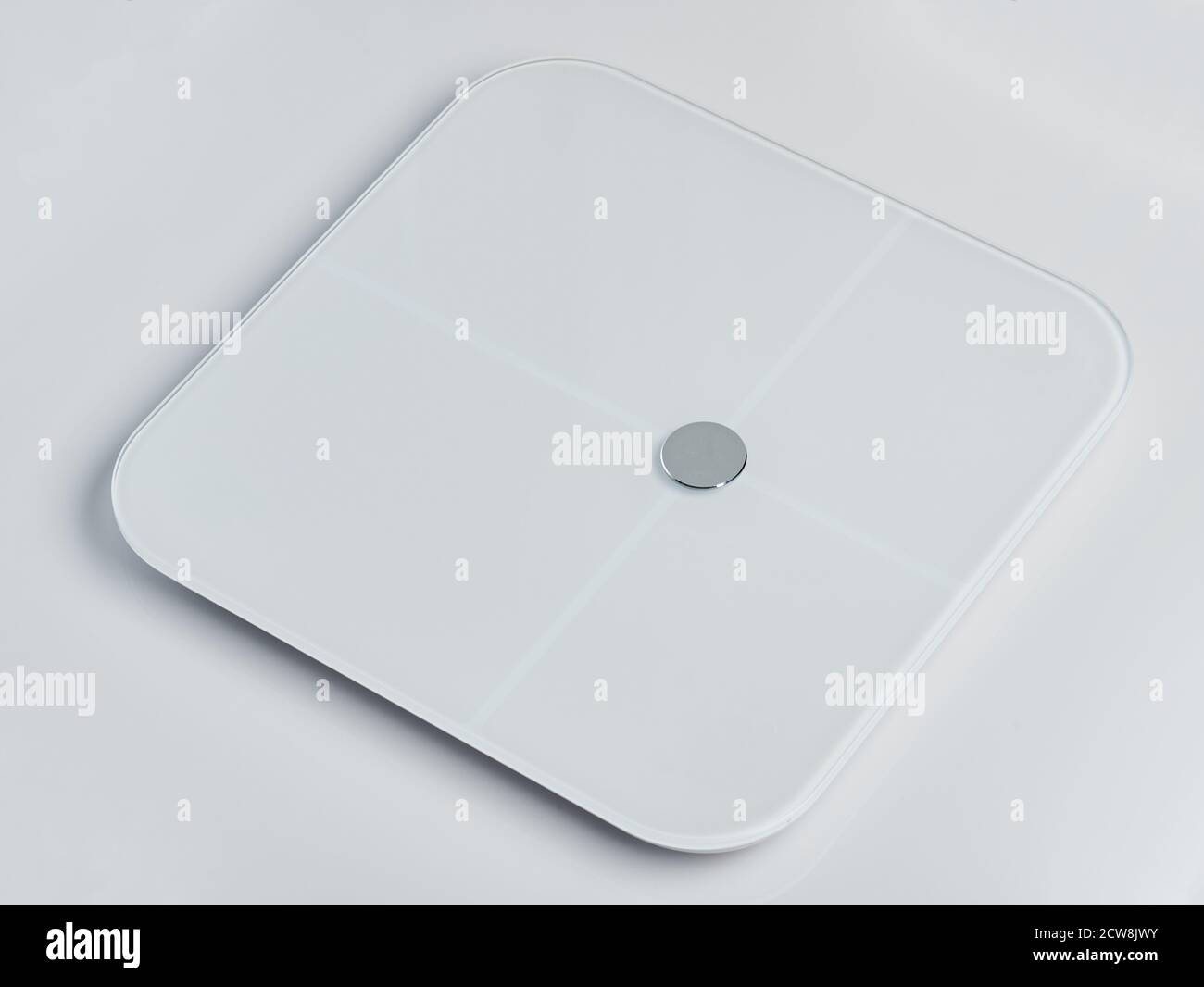 White modern weight glass scale isolated on studio background Stock ...