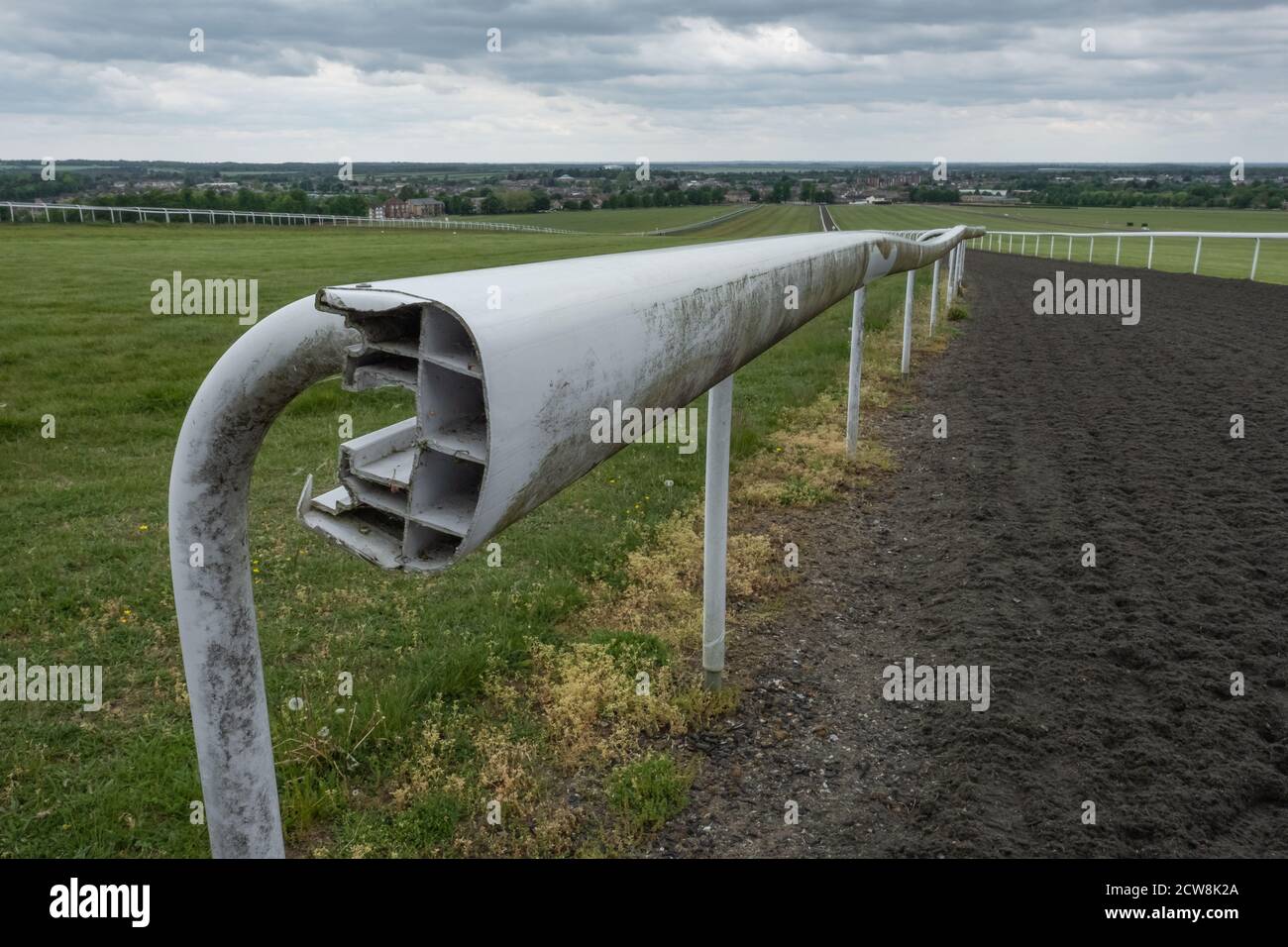 Shallow focus of a broken plastic barrier seen on a equine racecourse ...