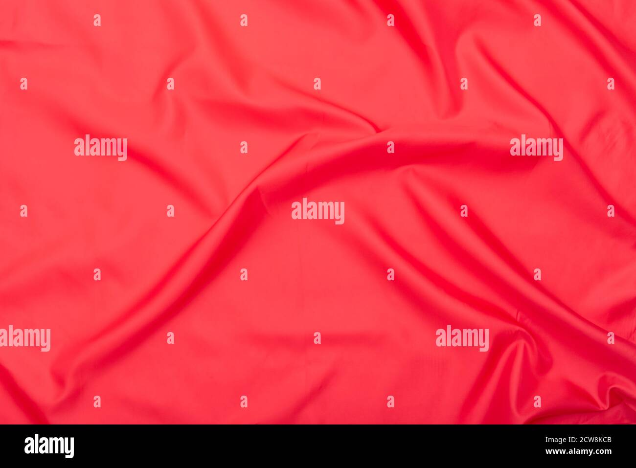 Natural red fabric, texture of red wavy cloth, top view Stock Photo - Alamy