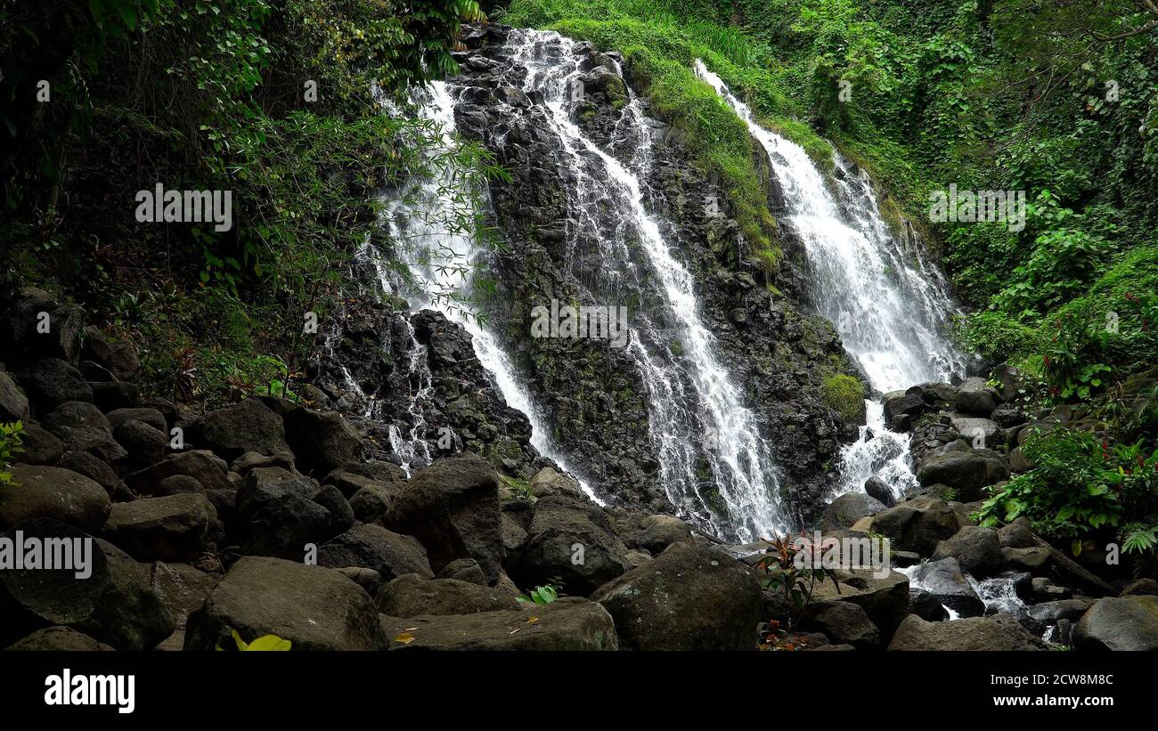 Mimbalut Falls in green forest. Waterfall in the tropical mountain ...