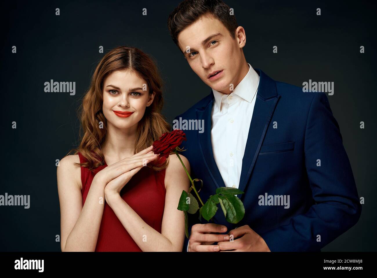 luxury couple hug romance relationship rose over dark isolated ...