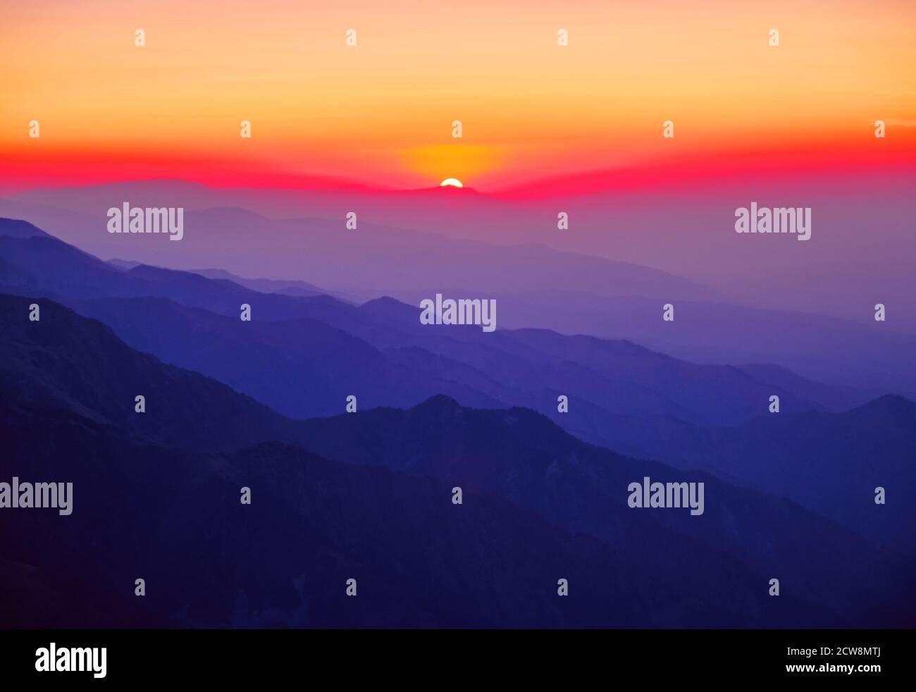 Majestic mountain landscape with silhouettes of mountain ridges at ...