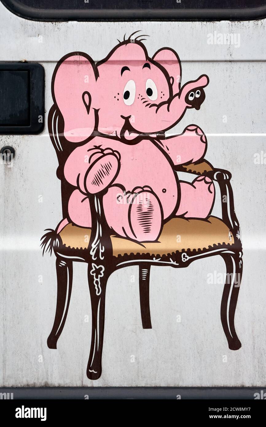 Pink elephant in a chair, picture on the back of a car Stock Photo - Alamy