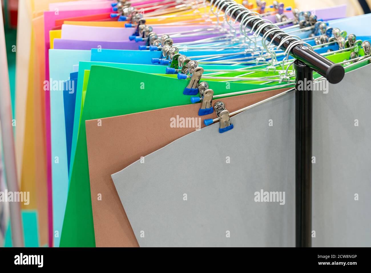 Sheets of decorative multi-colored paper on the showcase Stock Photo ...
