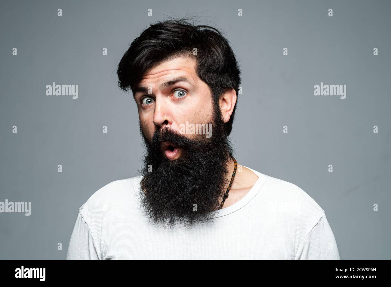 Head And Shoulders Portrait Of Surprised Handsome Man Shocked Male