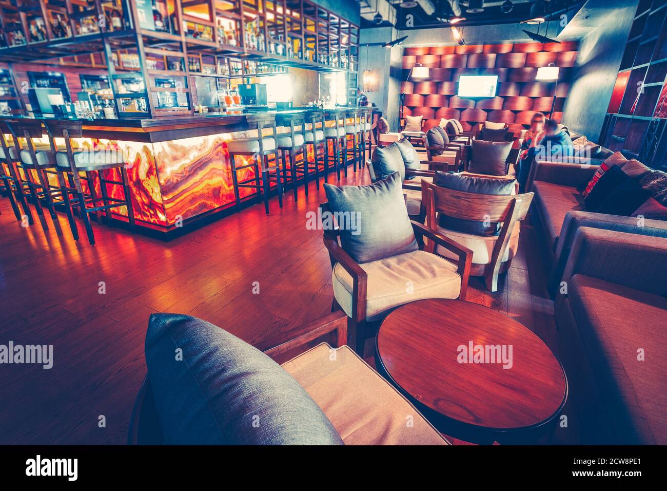 Pub interior design: modern place with armchairs and tables for people ...